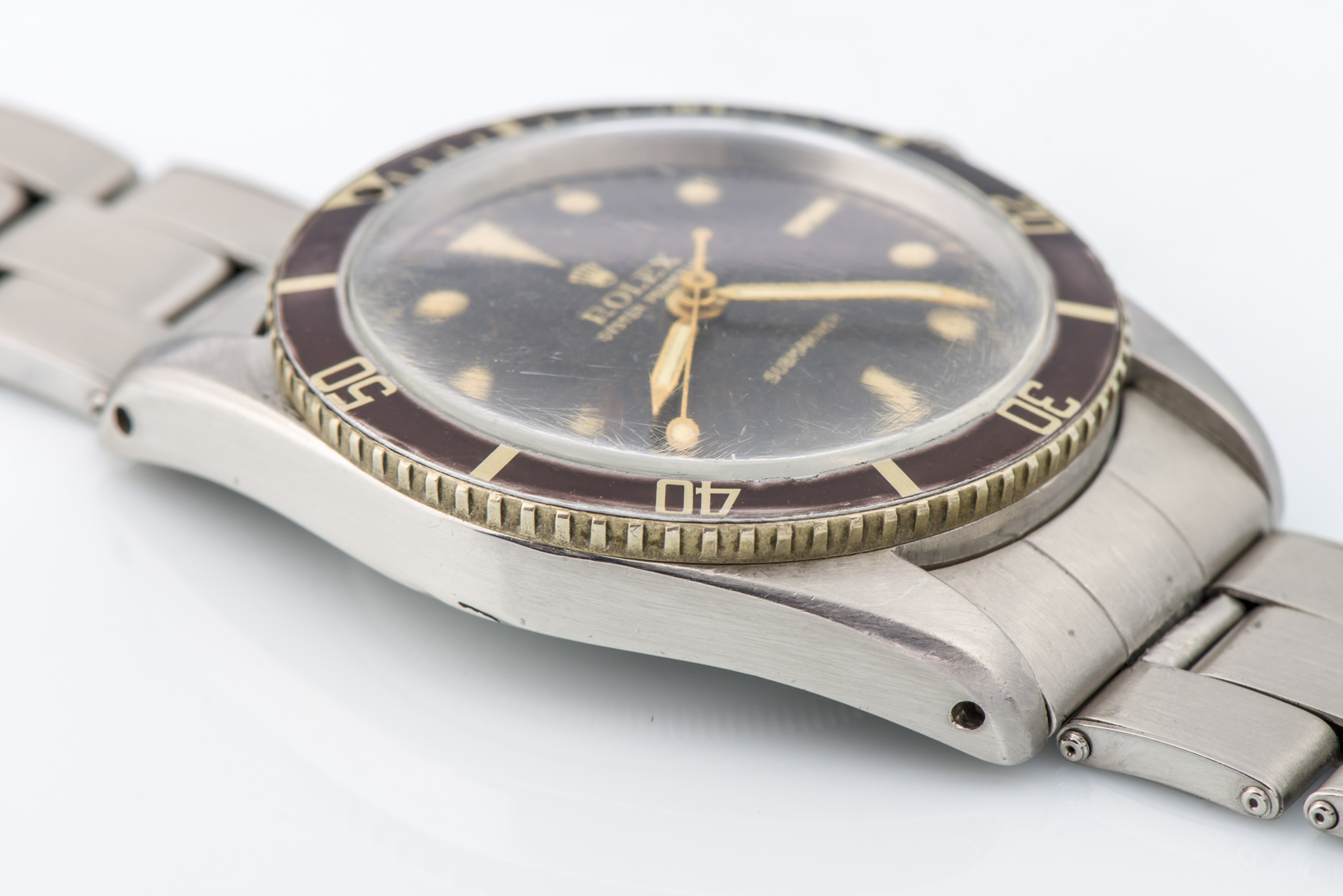ROLEX, REF. 6204, EARLIEST SUBMARINER TROPICAL GILT DIAL, STEEL ...